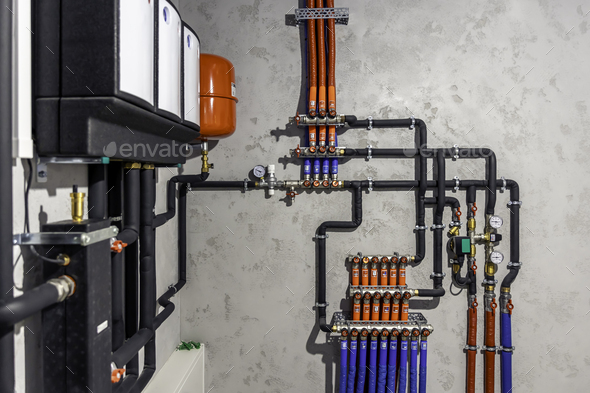 Modern autonomous heating system in the boiler room. Stock Photo by puhimec