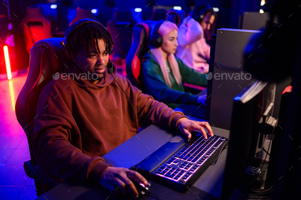 Pro african american eSports male gamer playing online strategy video ...