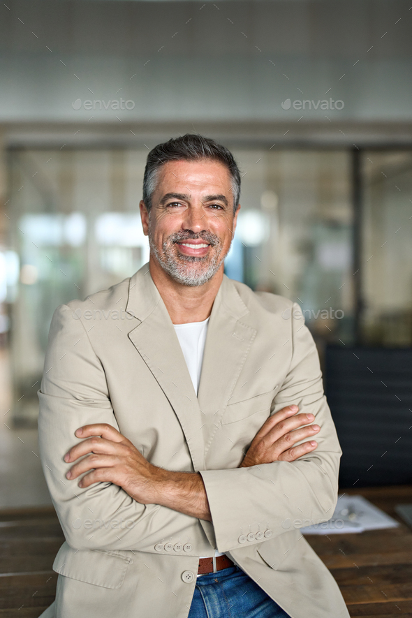 Confident mature business man ceo executive leader in office. Vertical ...