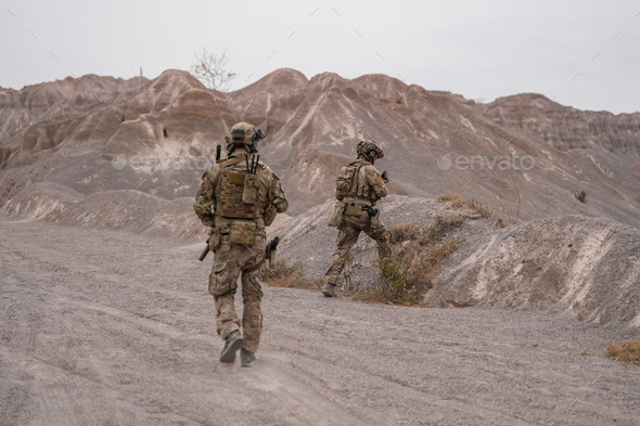 Squad of Soldiers Running Forward and Atacking Enemy During Military ...