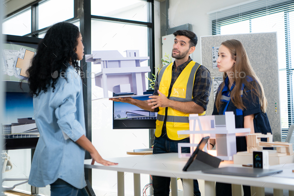 Engineers, architects, and designers collaborate to design a building ...