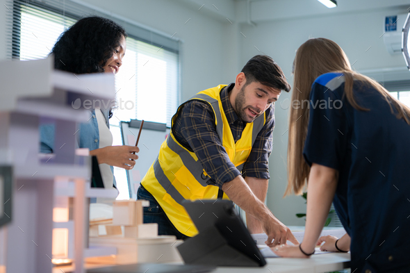 Engineers, architects, and designers collaborate to design a building ...