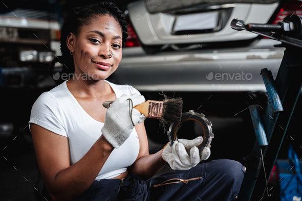 Portrait of the mechanic checklist the parts around the car in detail ...