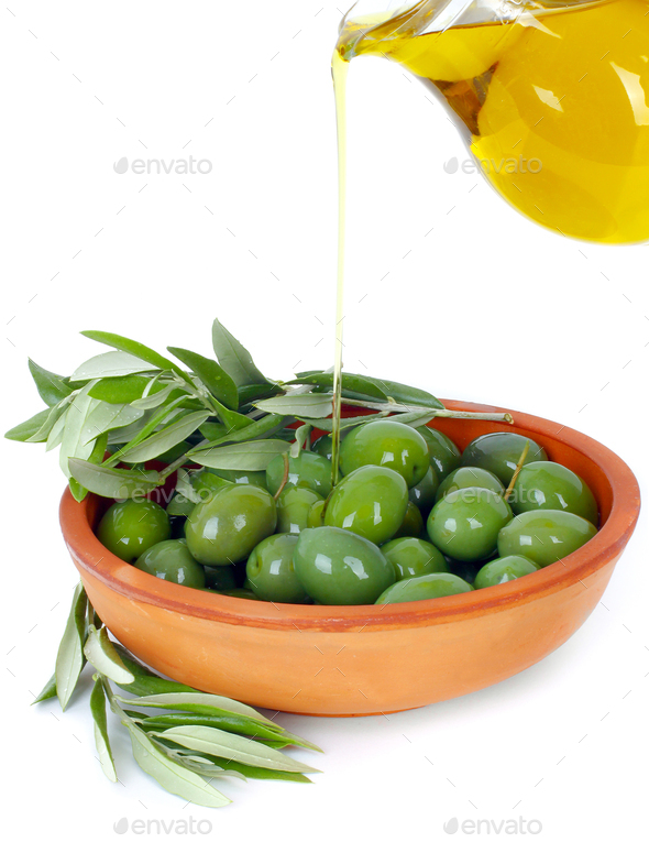 Olive oil and branches of an olive tree Stock Photo by AntonioGravante