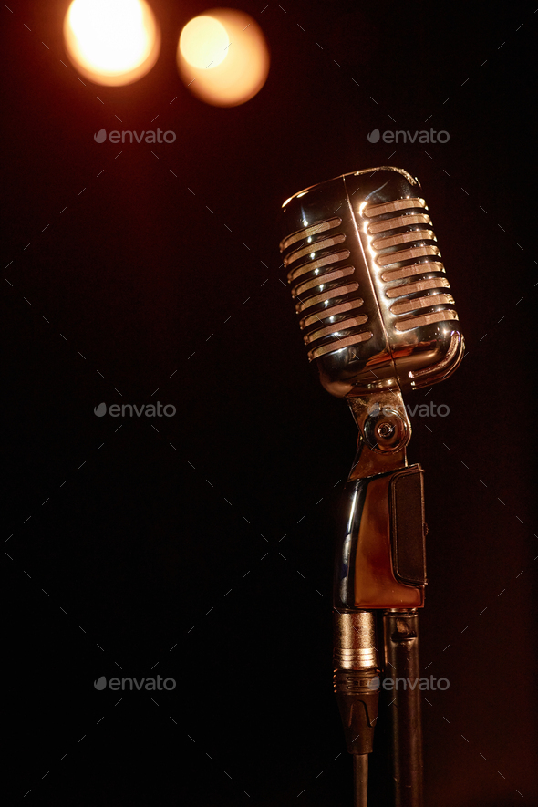 Retro Microphone on Stage with Lights Stock Photo by seventyfourimages