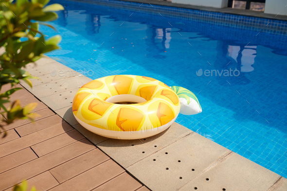 Inflatable Ring at Swimming Pool Stock Photo by DragonImages | PhotoDune
