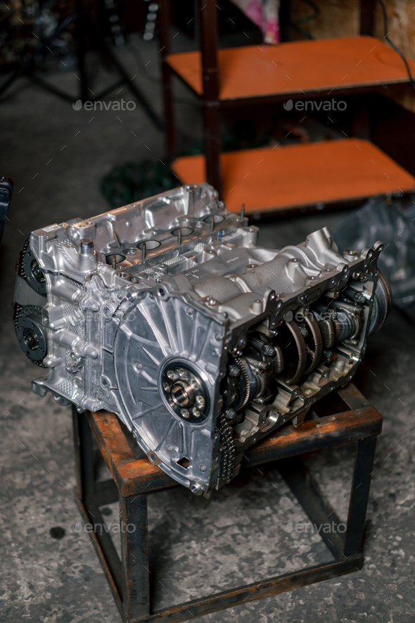 engine block on the table the mechanic opened the locking valve ...