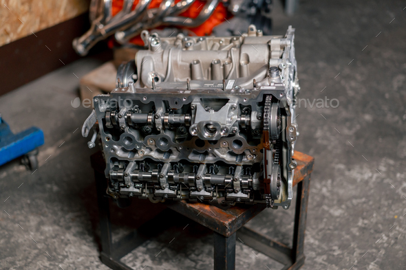 engine block on the table the mechanic opened the locking valve ...