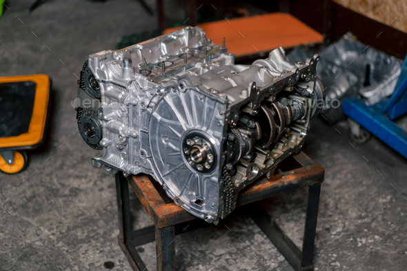 engine block on the table the mechanic opened the locking valve ...