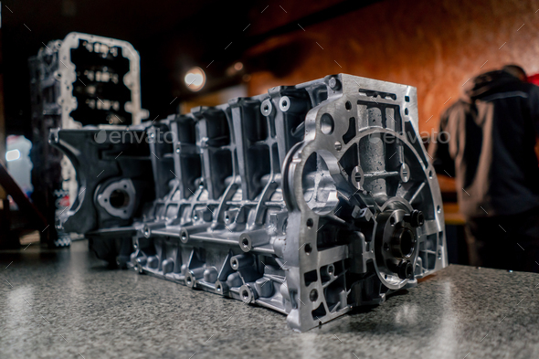 engine block on the table the mechanic opened the locking valve ...