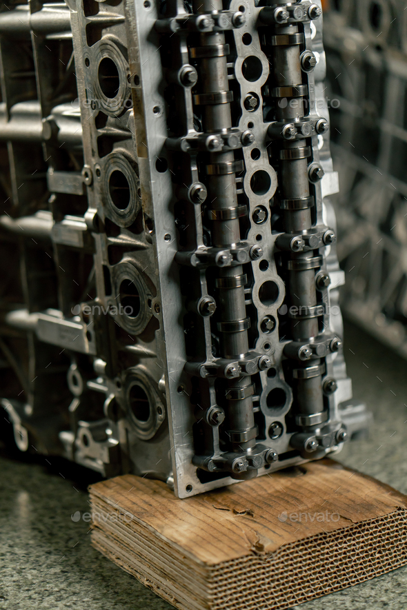 engine block on the table the mechanic opened the locking valve ...