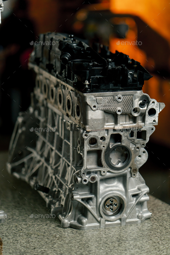 engine block on the table the mechanic opened the locking valve ...