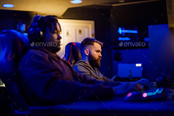 Bearded man gamer participating in a gaming competition in a esport ...