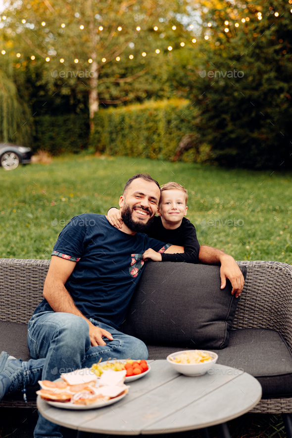 Heartwarming Portrait of Father Laughing with His Child and Cuddling on ...