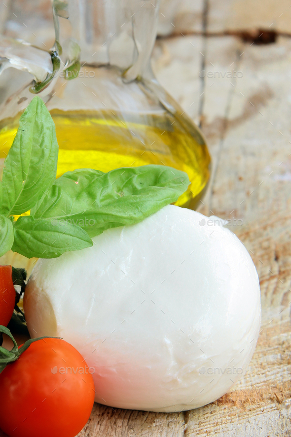 traditional Italian mozzarella cheese with fresh basil Stock Photo by ...