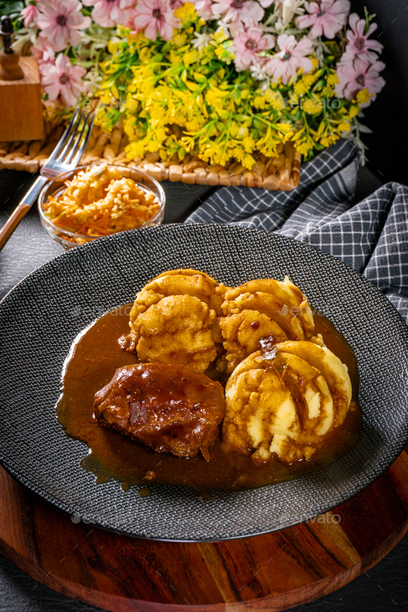 Traditional German braised pork cheeks in brown sauce. Stock Photo by ...