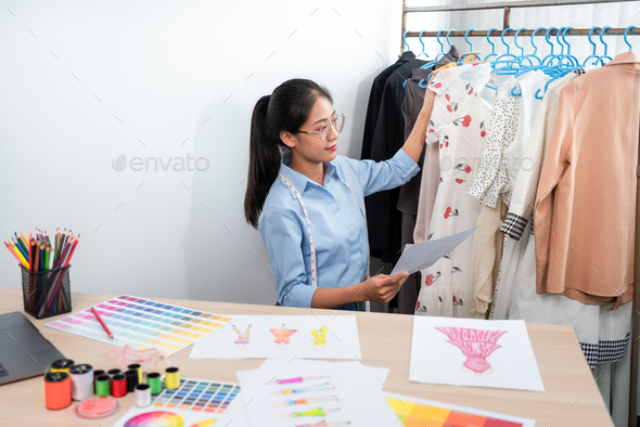 Women fashion designer stylist working and thinking decide choosing ...