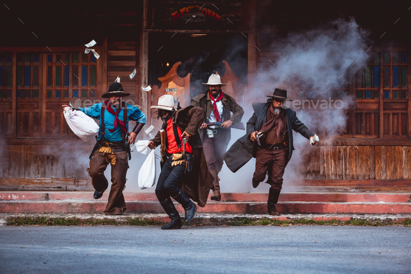 Cowboys group showing action success bank rob with fighting gun and a ...