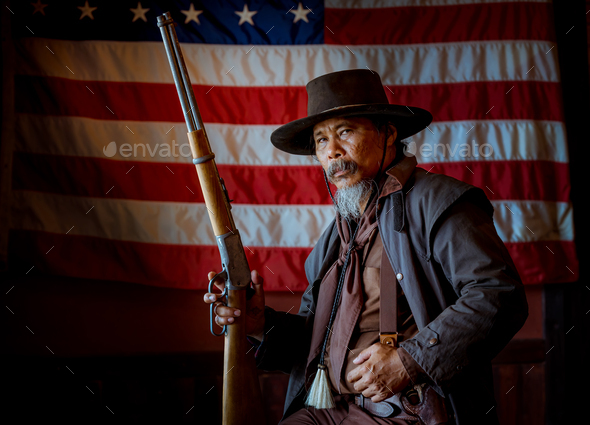 Portrait oldest cowboy posing with his gun to point cowboy hat show ...