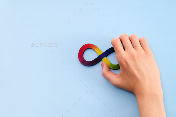 Autistic boy hands and rainbow eight infinity symbol. Autism awareness ...