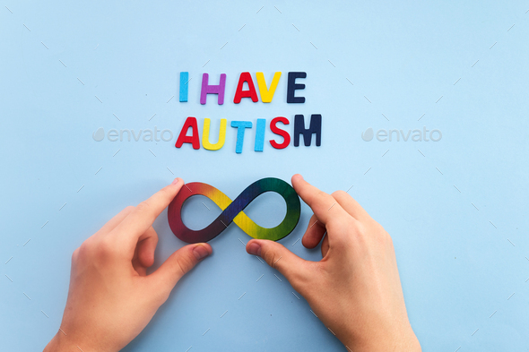 Autistic boy hands and rainbow eight infinity symbol. Autism awareness ...