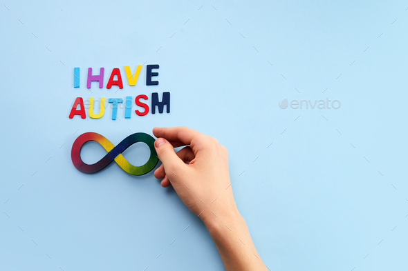 Autistic boy hands and rainbow eight infinity symbol. Autism awareness ...