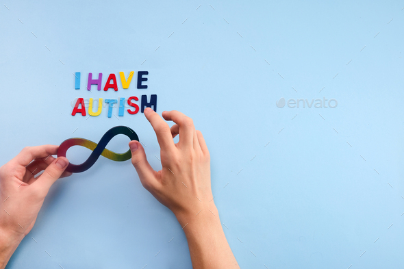Autistic boy hands and rainbow eight infinity symbol. Autism awareness ...