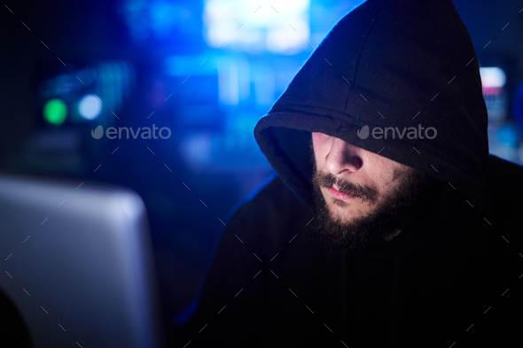 Close up hidden hacker in sweatshirt and hoodie hacking security ...