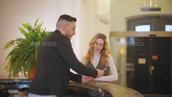 Friendly interaction at the reception of a modern office setting Stock ...