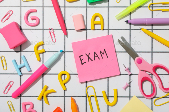 Exam, the word is written with a marker on a piece of paper. Stock ...