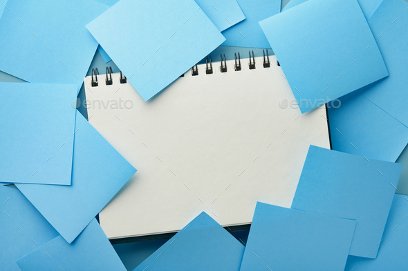 Blue paper stickers on black background. Sticky notes blank with copy ...