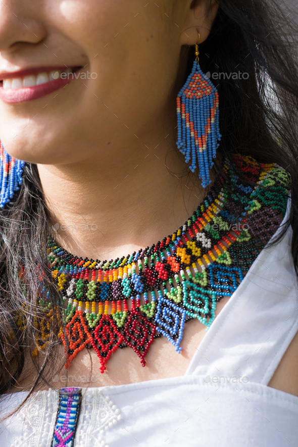 A young woman in traditional attire celebrating their indigenous roots ...