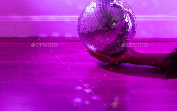 hand holding a disco ball in neon light Stock Photo by lucky_ch | PhotoDune