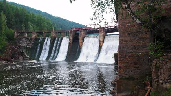 Water Dam in the Forest - River Water Falls Down Under the Bridge ...