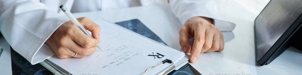 Doctor Writing out Prescription Stock Photo by DragonImages | PhotoDune