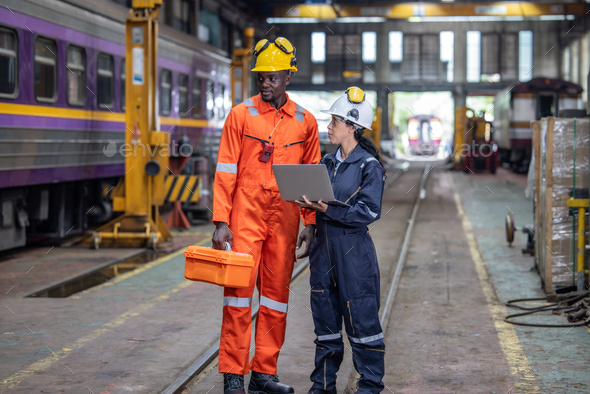 Engineer supervisor uses laptop for train diagnostics, maintenance, and ...