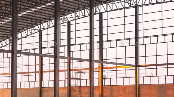 Metal columns with curve roof beam inside of factory building structure ...