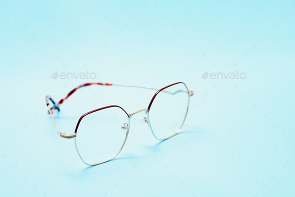 Poster of glasses on pastel background. Optics. Vision. Stock Photo by ...