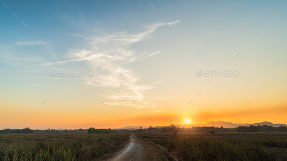 Golden Sunset Sky with orange sunlight in the evening over Hill ...