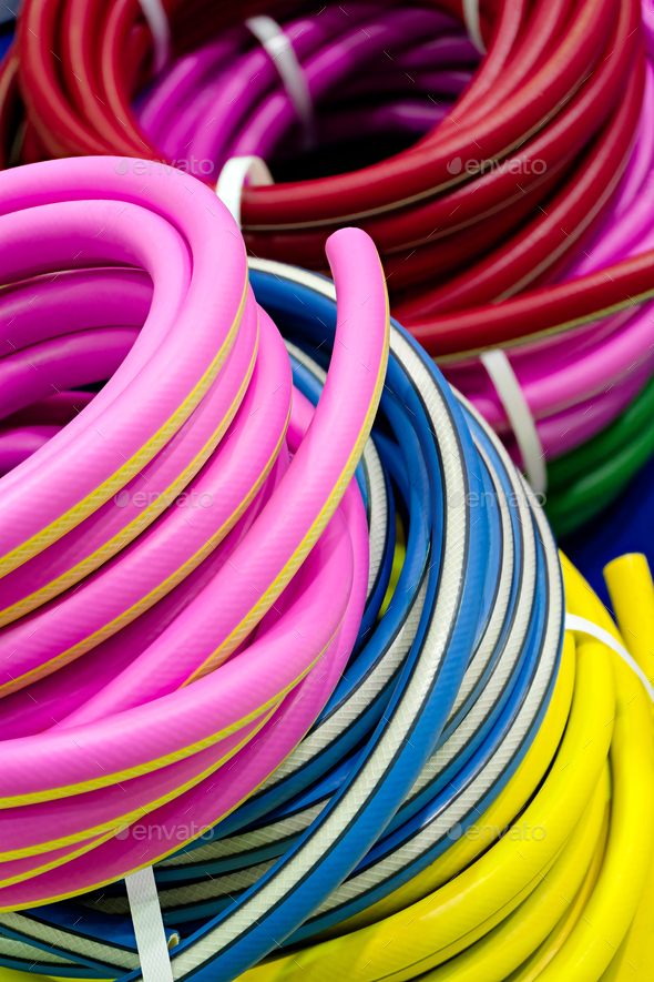 Rolled up colorful garden hose Stock Photo by sergeyskleznev | PhotoDune