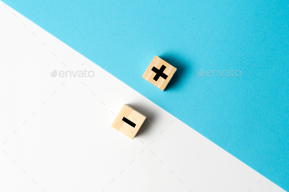 The concept of opposites or pros and cons using plus and minus signs ...