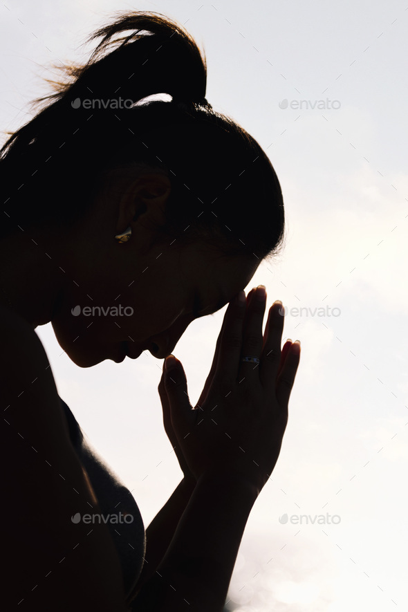 woman practicing yoga in pray position Stock Photo by Raul_Mellado