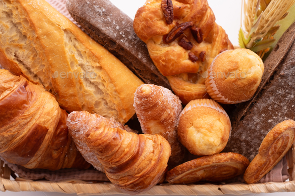 Close-up on bakery - various kinds of breadstuff. Rye bread, wholemeal ...
