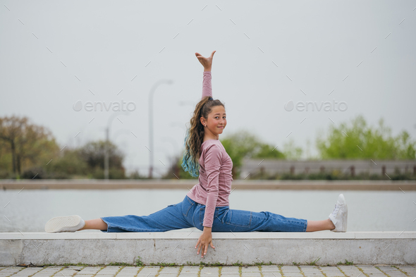 Portrait of a girl doing rhythmic gymnastics outdoors. Stock Photo by ...