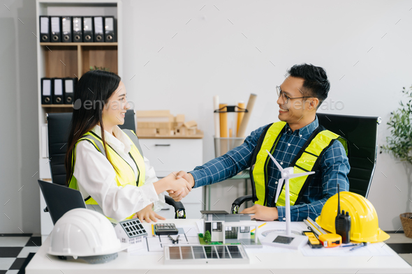Engineer desk with object paper and tablet with blurry engineer ...