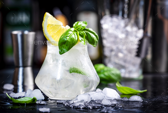 Summer icy cocktail drink with mezcal, liqueur, sugar syrup, lemon ...