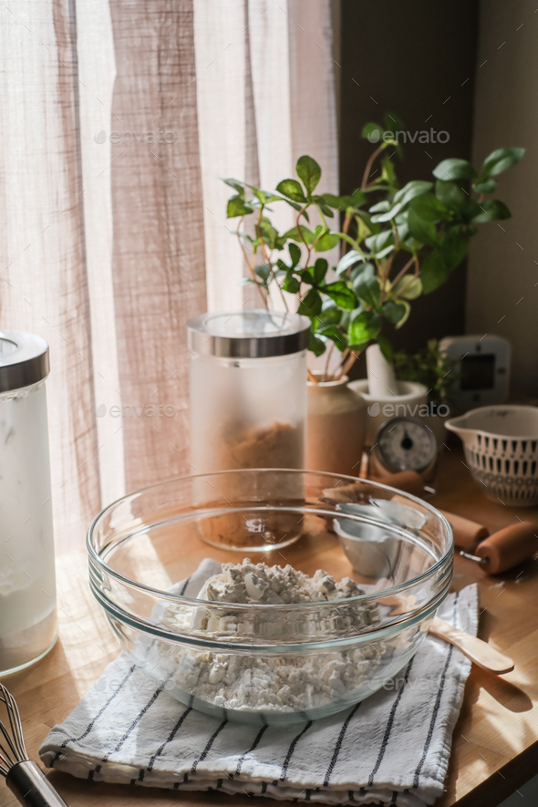 The beautiful kitchen countertop with flour and utensils for baking ...
