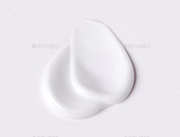samples of cosmetic care products smear of cream texture on a light ...
