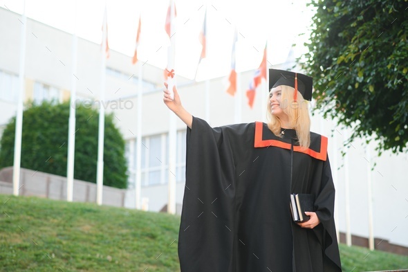 Happy graduation day for a young woman very beautiful with graduation ...