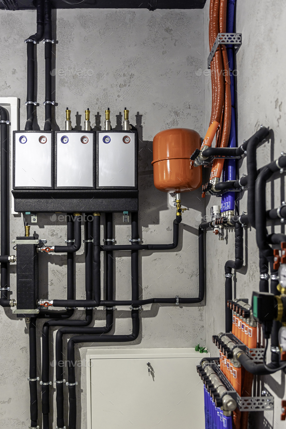 Modern autonomous heating system in the boiler room. Stock Photo by puhimec